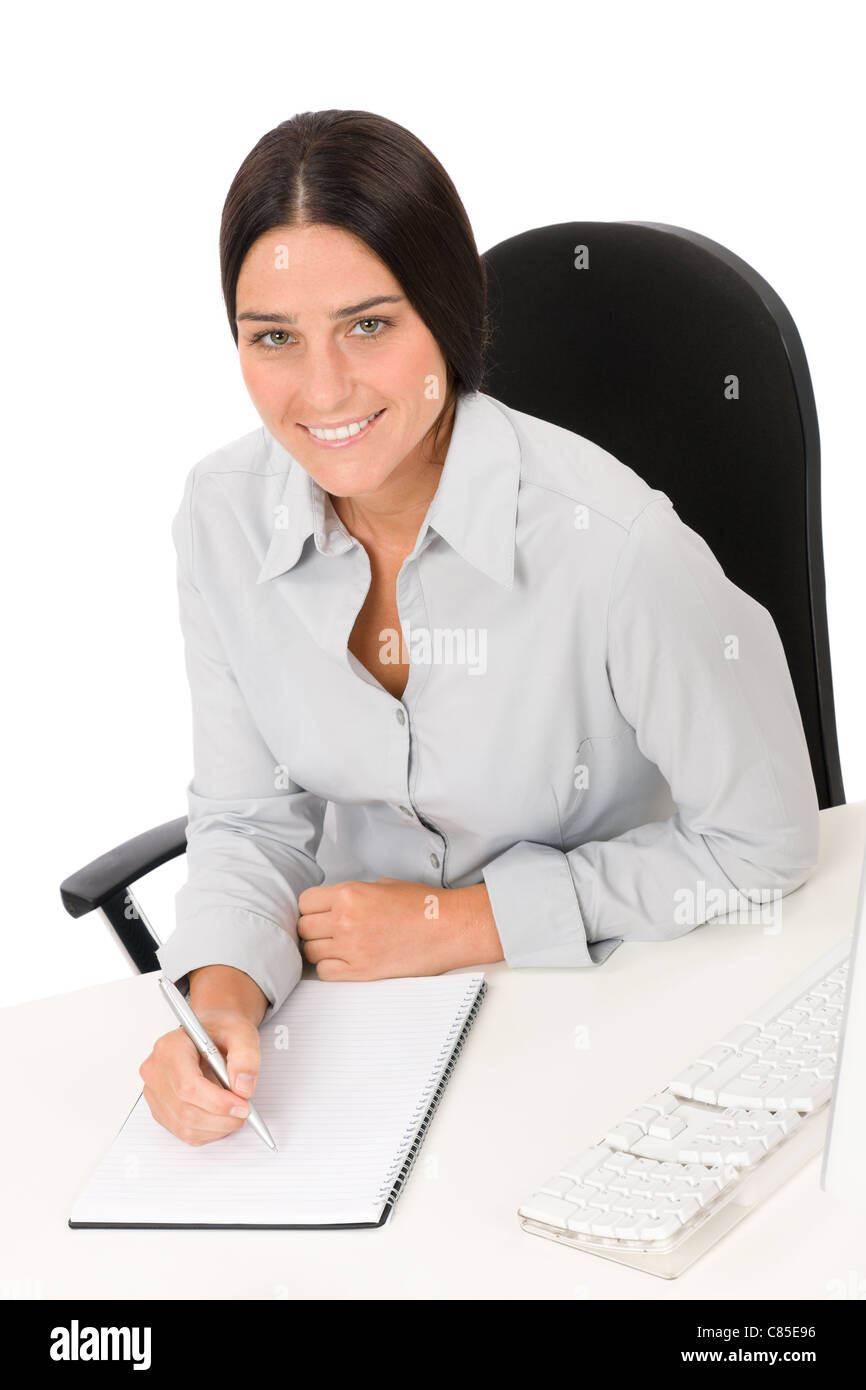 Successful business woman at office thinking sitting table write ...