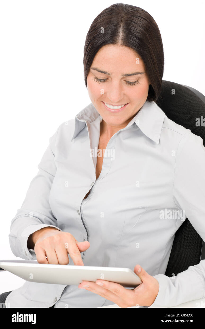 Attractive businesswoman holding touch tablet screen computer typing ...