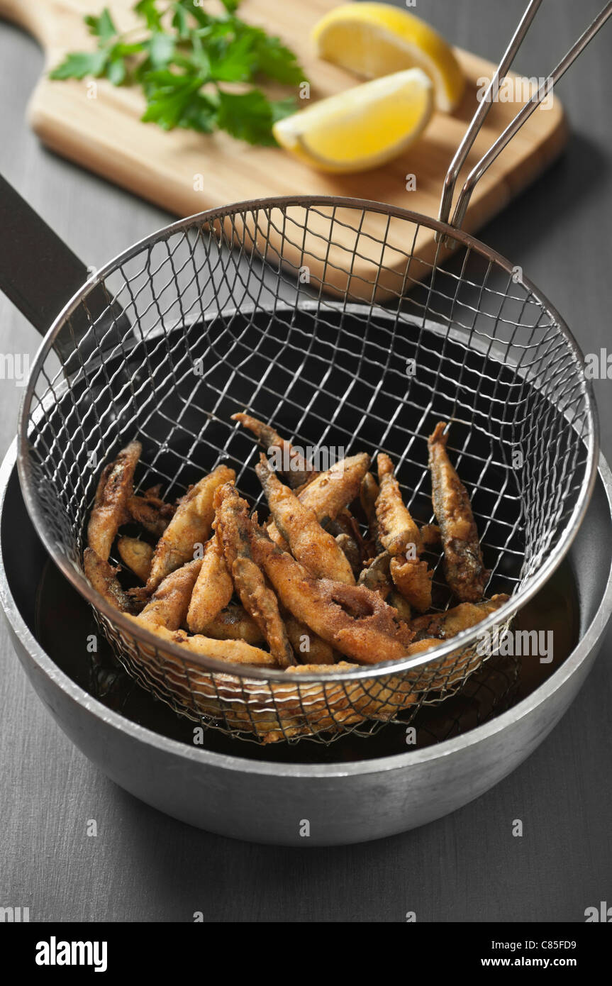 Devilled whitebait in frying basket Stock Photo - Alamy
