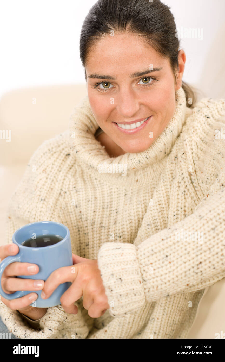 Happy woman with coffee cup wear pullover on white background Stock ...