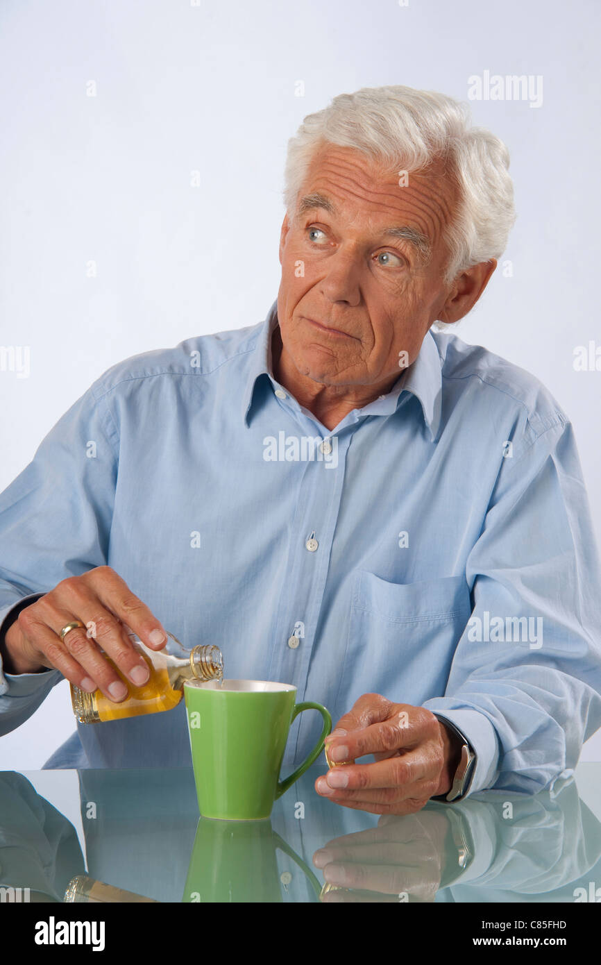 Man adding Alcohol to his Coffee Stock Photo - Alamy