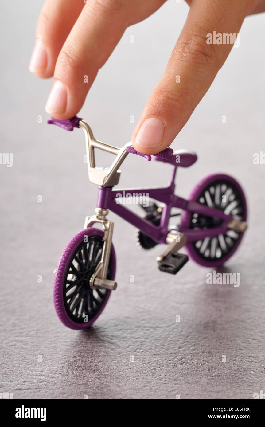 Fingers Touching Miniature Bike Stock Photo - Alamy