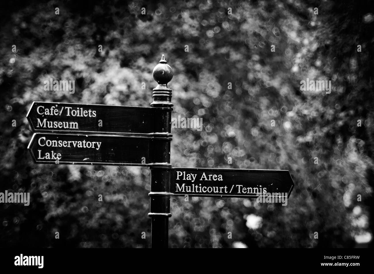 Direction signs within a park Stock Photo - Alamy