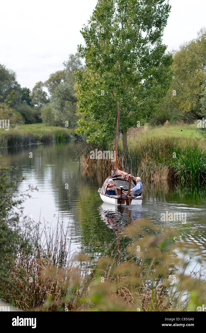 older couple boating on river great ouse at fen drayton cambridge ...