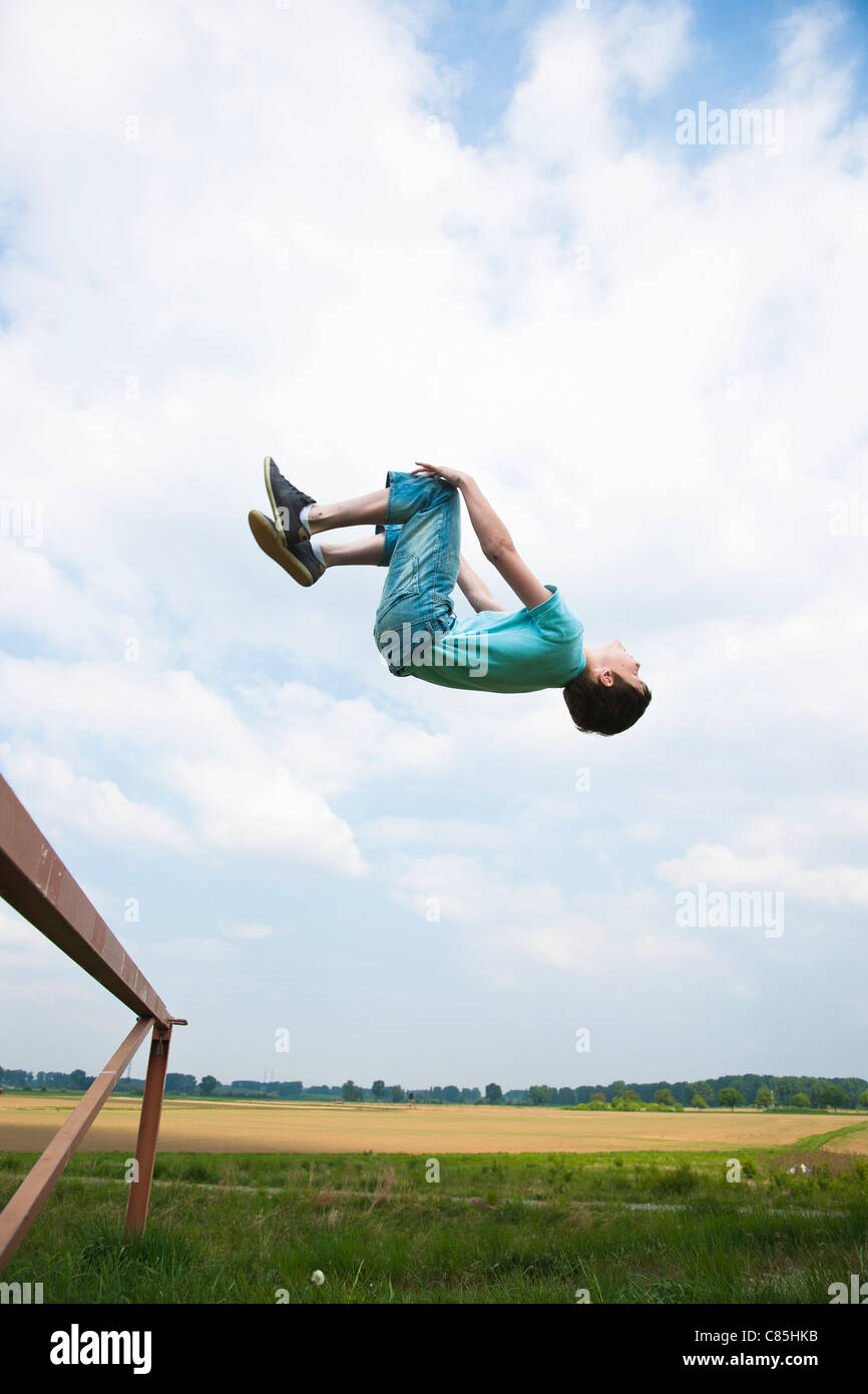 Boy Jumping off Trampoline Stock Photo - Alamy