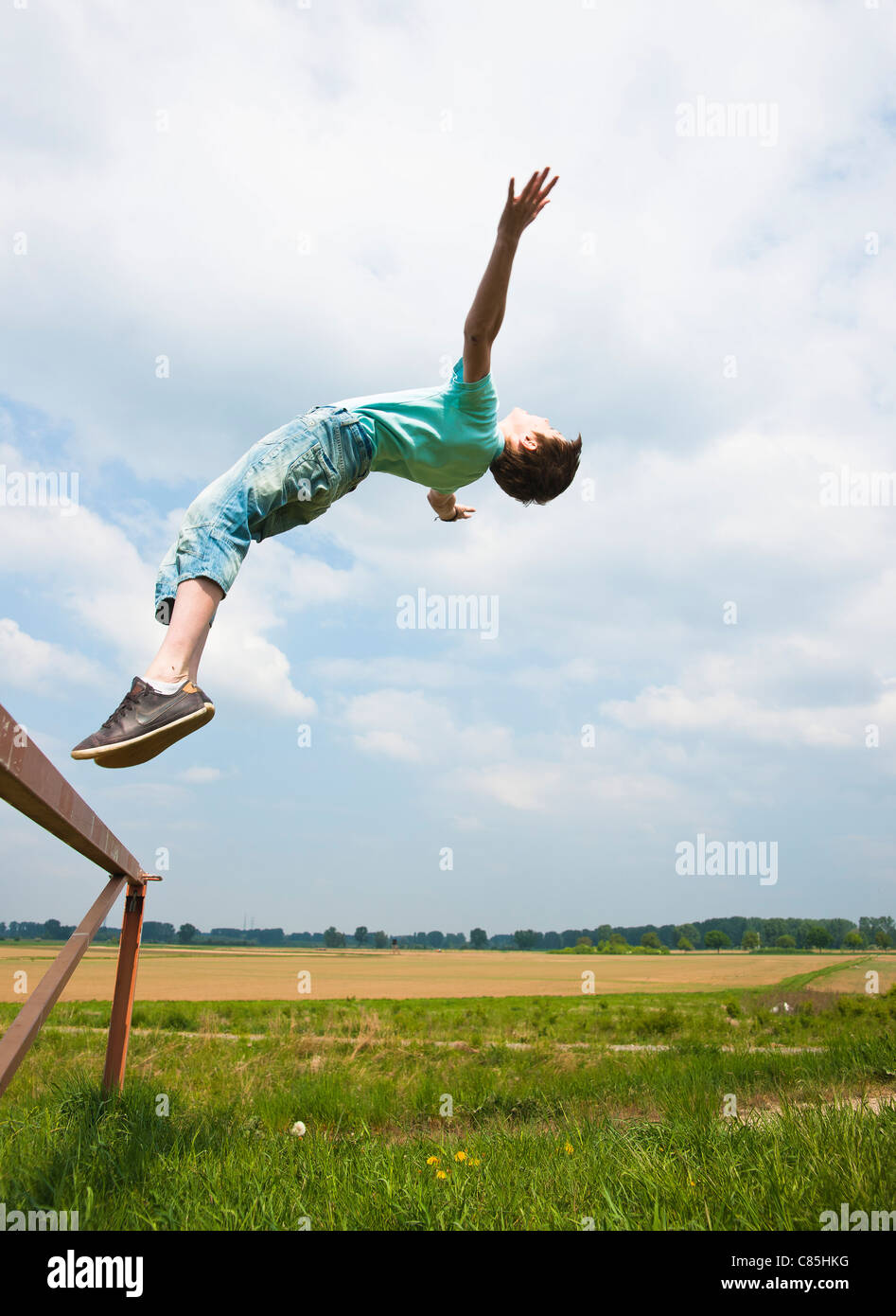 Boy Jumping off Trampoline Stock Photo - Alamy