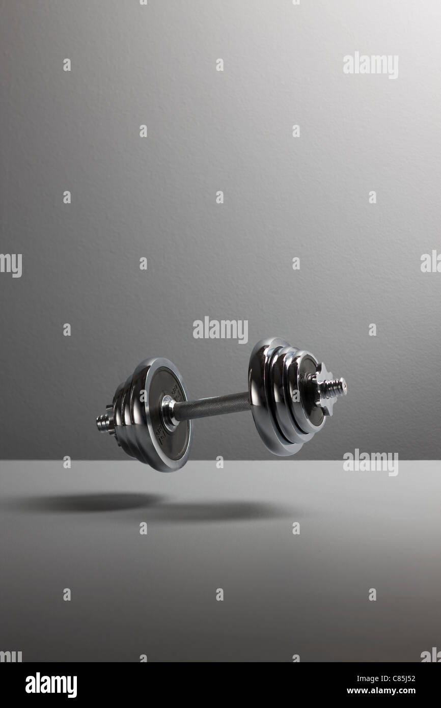 Barbells against gray background Stock Photo - Alamy