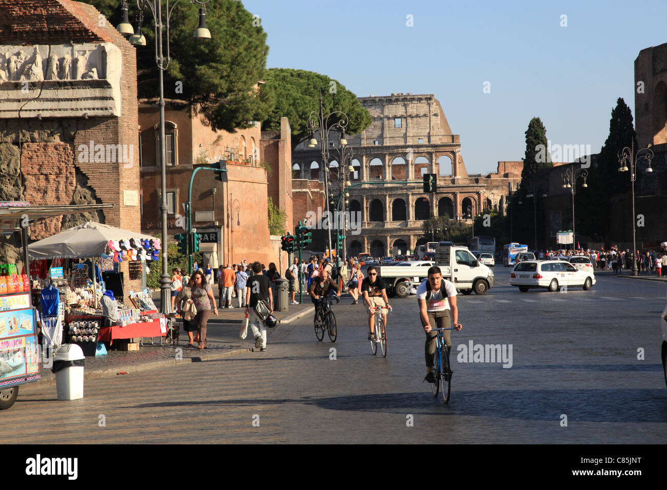 Rome, bicycle riders near Coliseum on Via dei Fori Imperiali Stock ...
