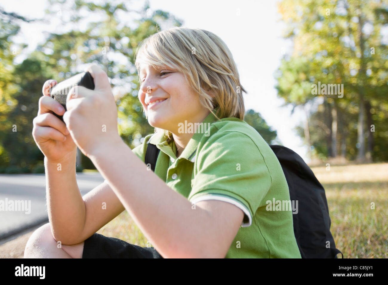Boy using Cell Phone Stock Photo - Alamy