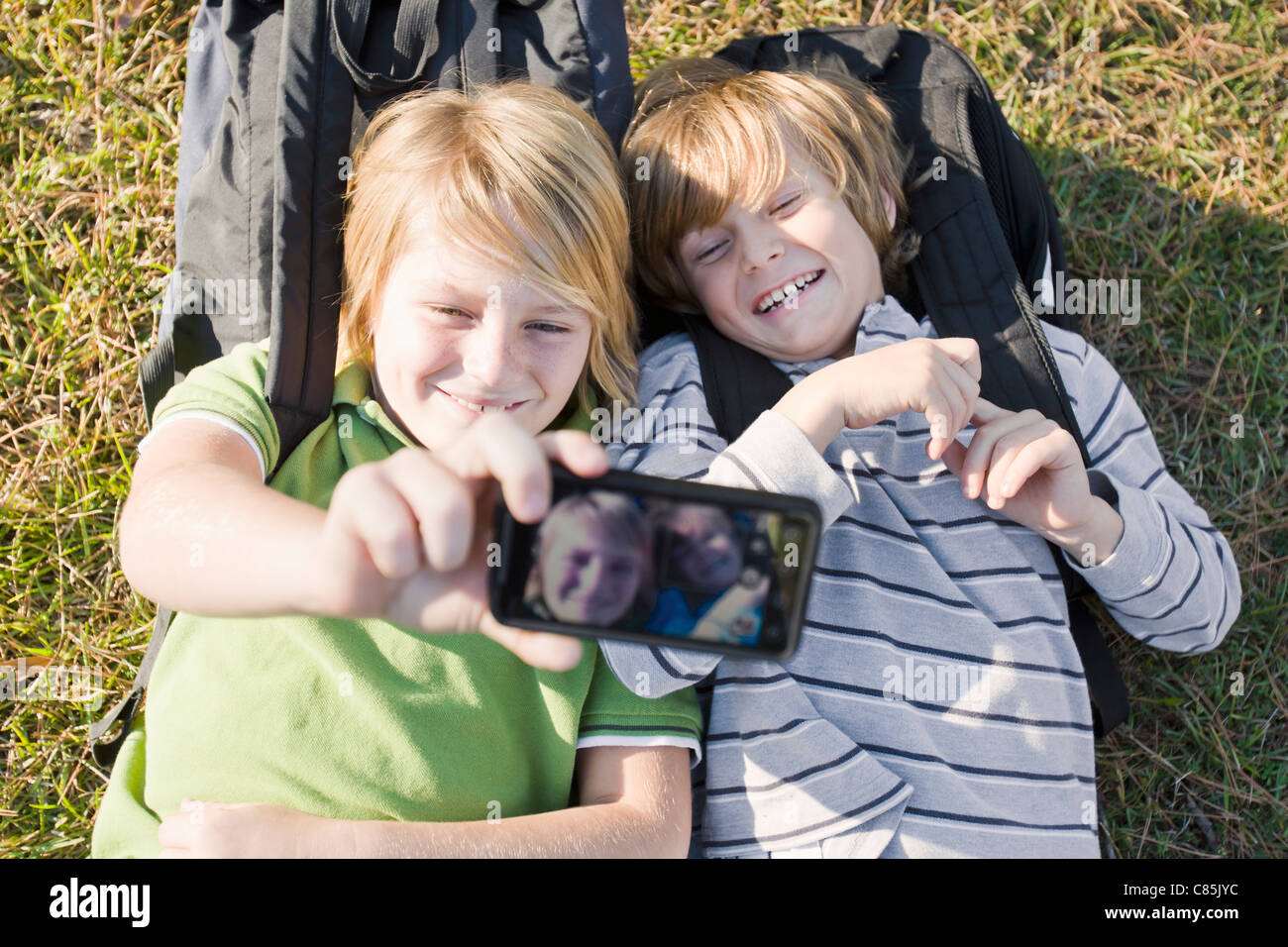 Boys taking Picture with Camera Phone Stock Photo - Alamy
