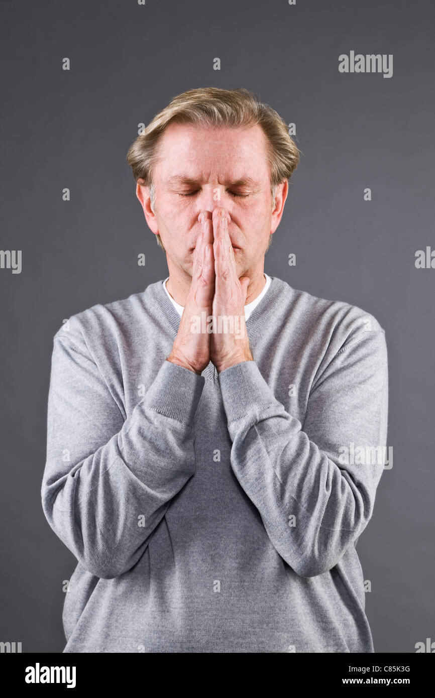 Portrait of Man Praying Stock Photo - Alamy