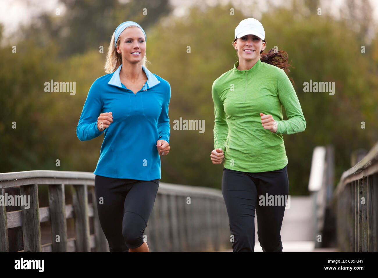 Woman running bridge through city hi-res stock photography and images ...
