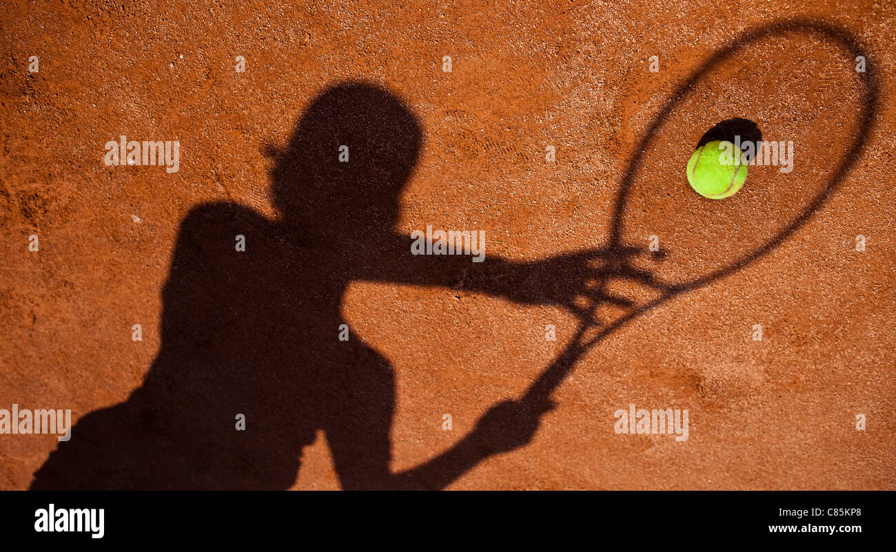 shadow of a tennis player in action on a tennis court Stock Photo - Alamy