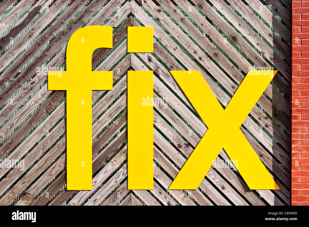 large fix sign in yellow Stock Photo - Alamy
