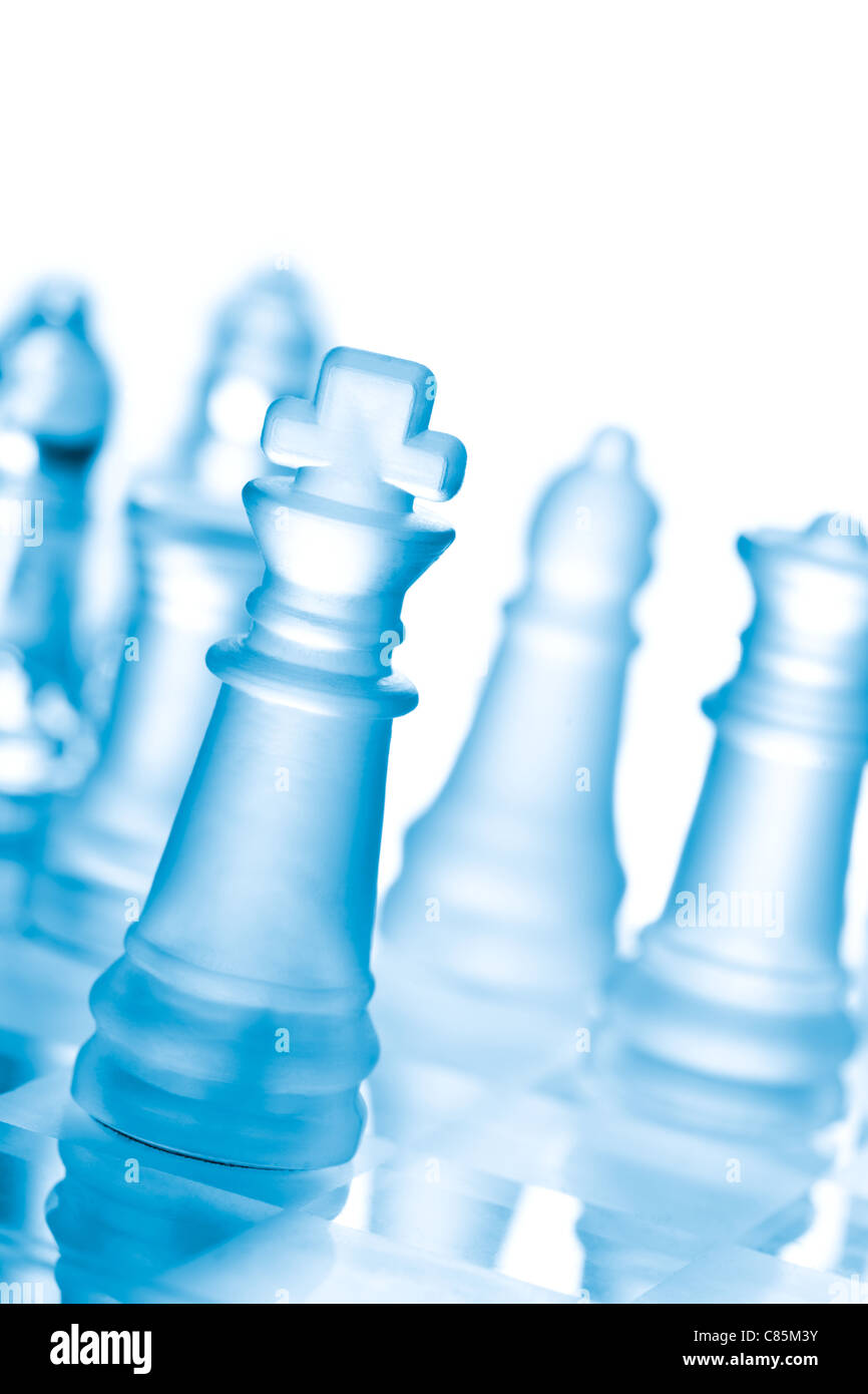 Leadership concept - glass chess on chess board blue Stock Photo - Alamy