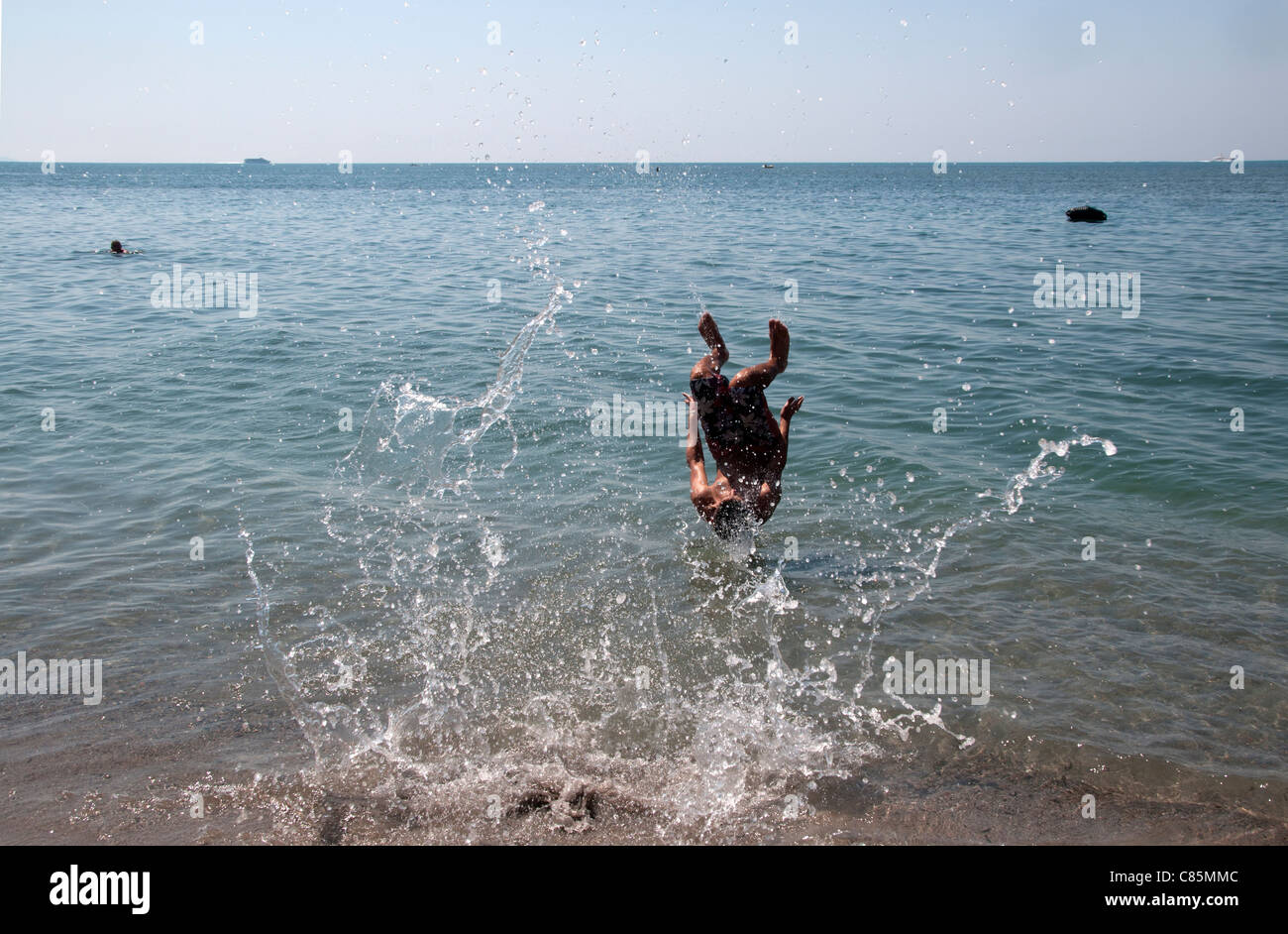 Boy doing somersault hi-res stock photography and images - Alamy