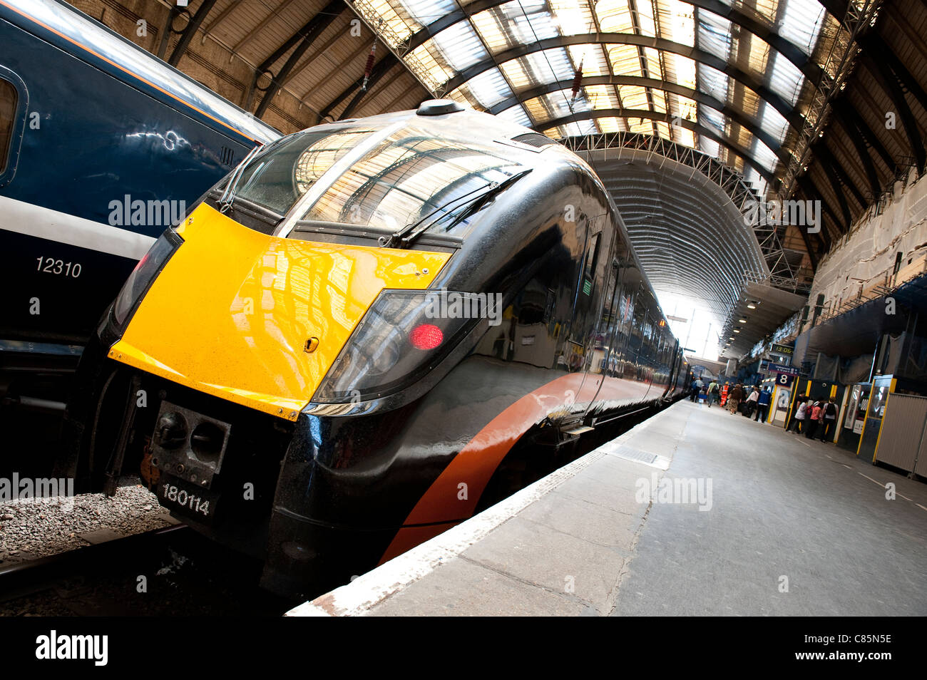 Passenger train in Grand Central livery, waiting at a London Kings ...