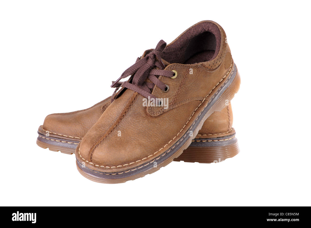 two brown shoes isolated on white background Stock Photo - Alamy