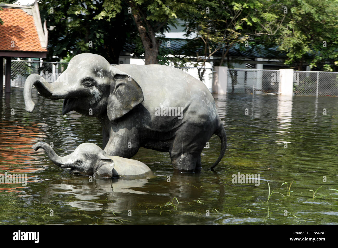 Elephants statue inundated with floodwaters on street in Ayutthaya ...