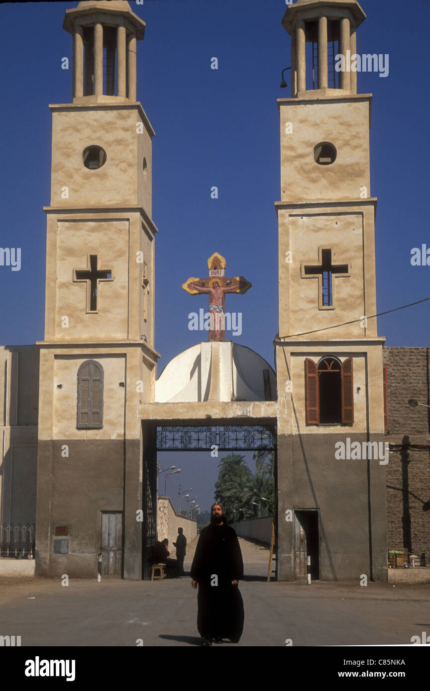 A Coptic Christian monk in front of Deir al Muharraq, the Burnt ...