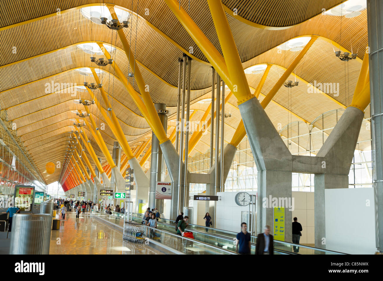 Passengers walk by at the new terminal T4 at Barajas airport April 25 ...