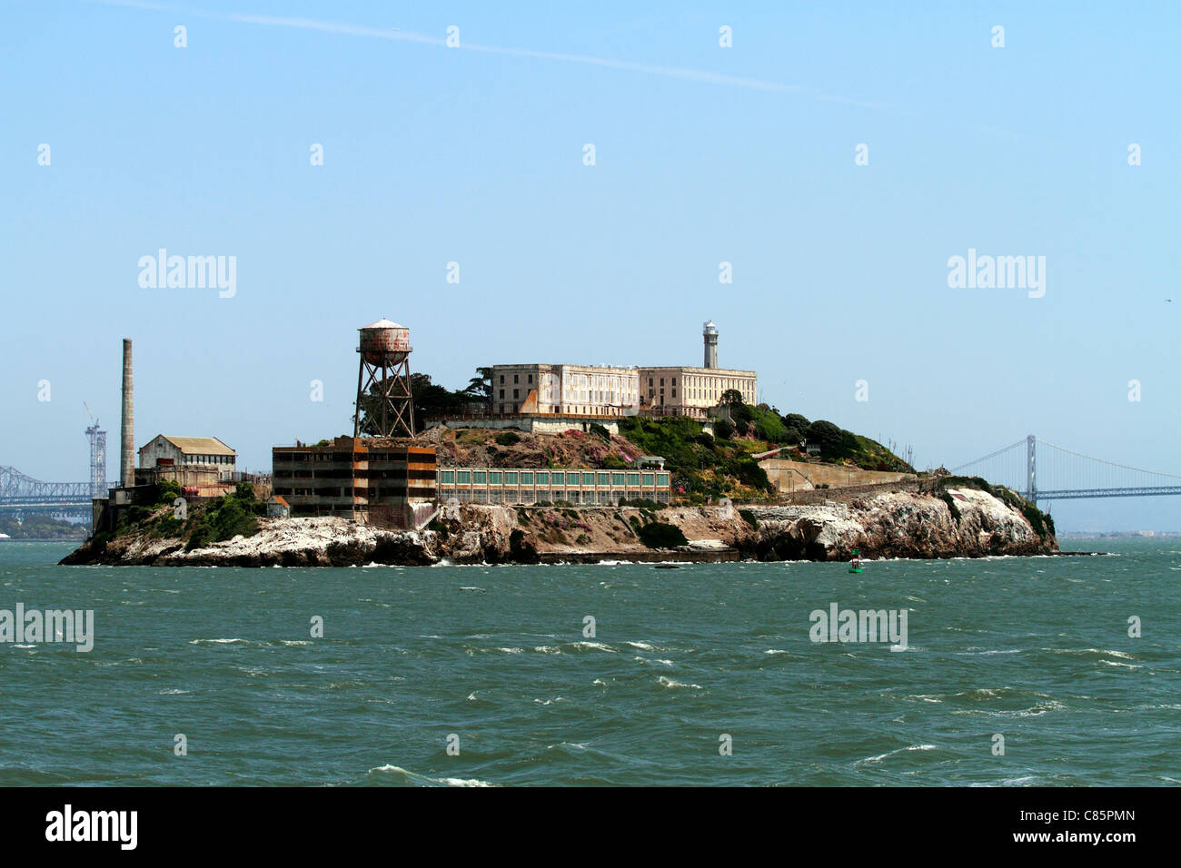 The former prison island of Alcatraz, Central bay bridge in the far ...