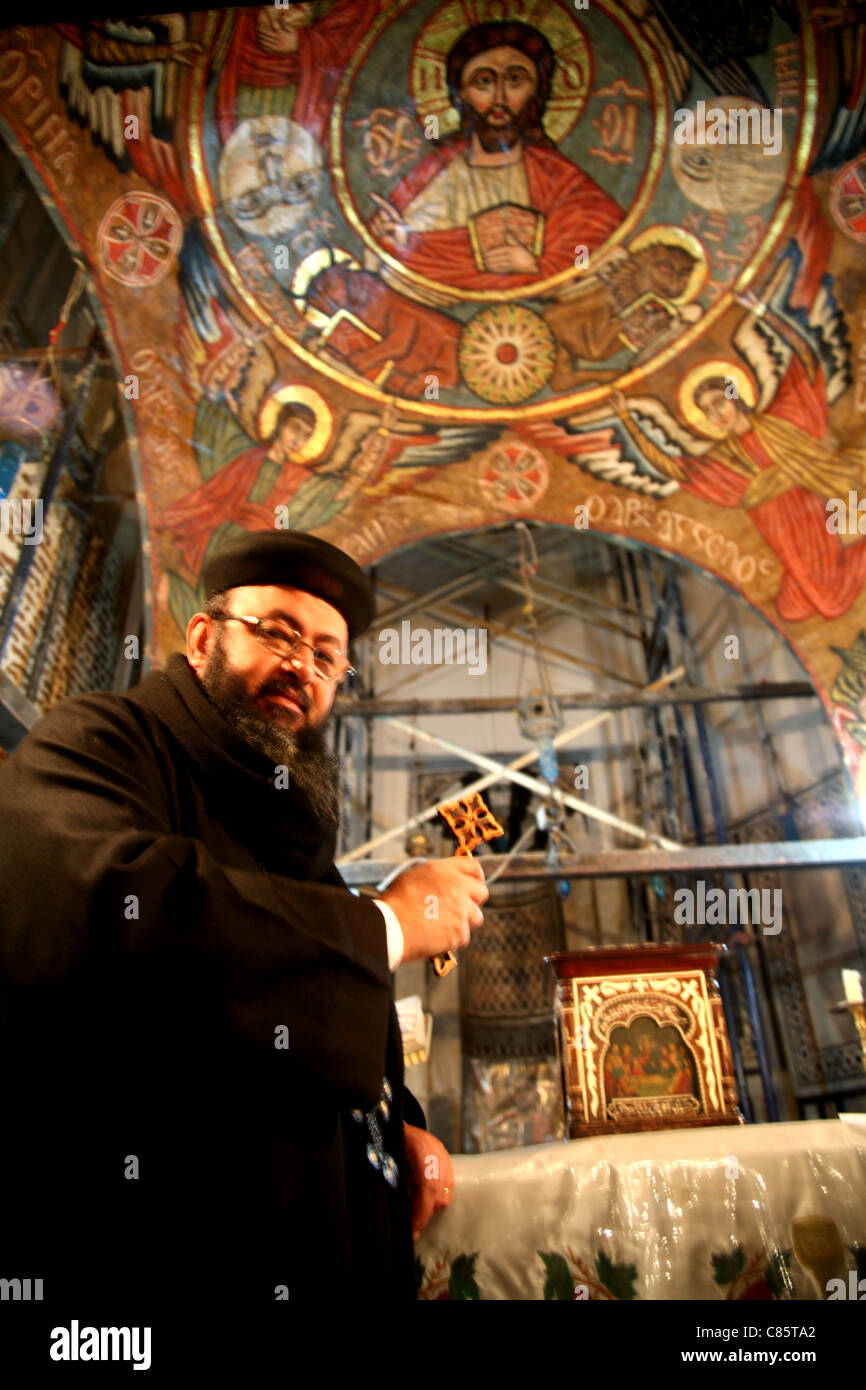 Coptic Christian priest in the Holy Virgin Church in Haret Zuweila Old ...