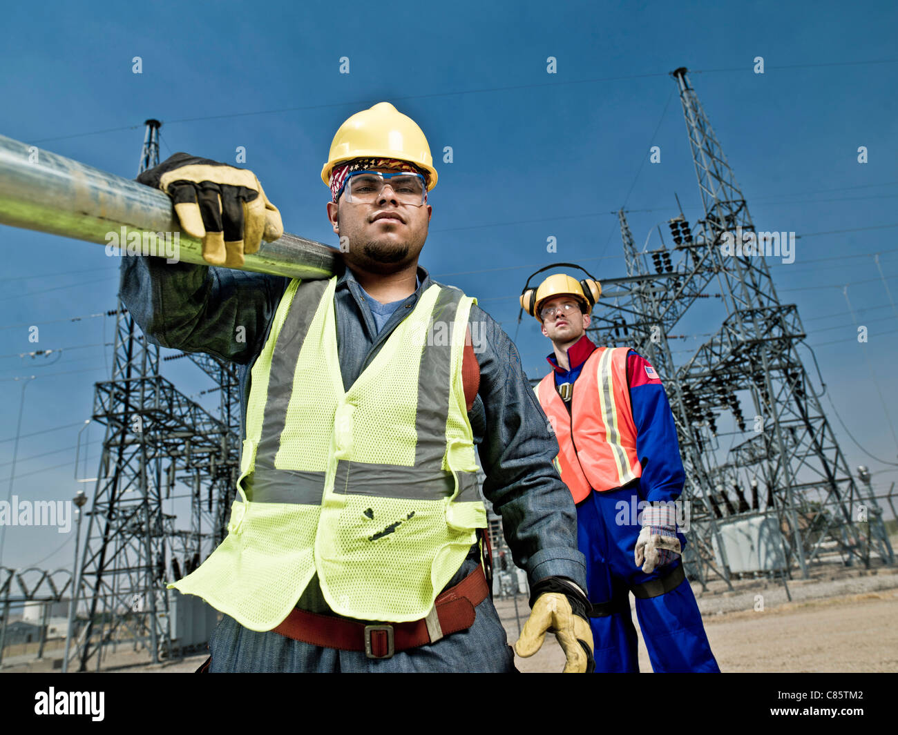 Construction workers standing together Stock Photo - Alamy