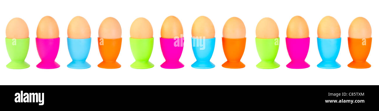 Row of colorful egg cups ideal for a banner or design Stock Photo - Alamy