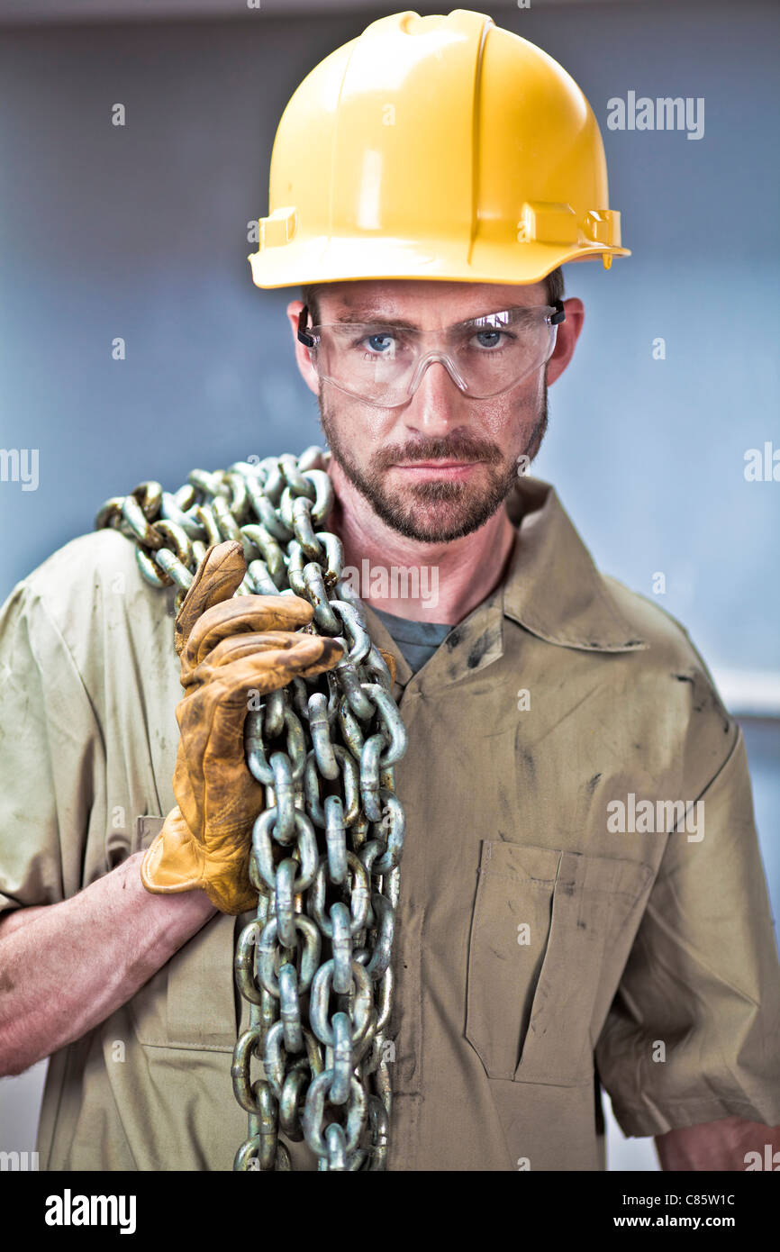 Builder holding hard hat hi-res stock photography and images - Alamy