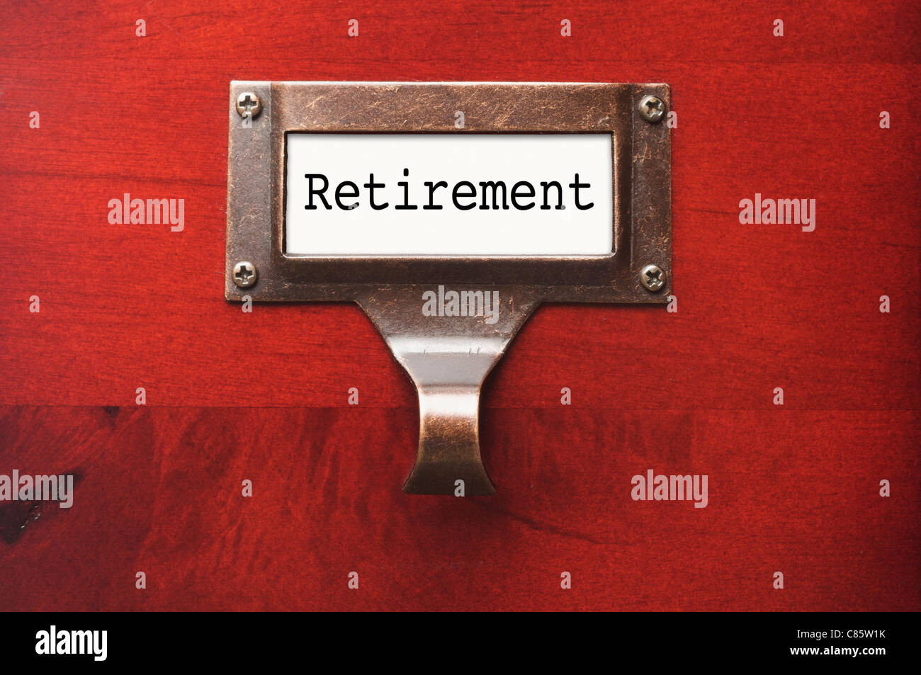 Lustrous Wooden Cabinet with Retirement File Label in Dramatic LIght ...