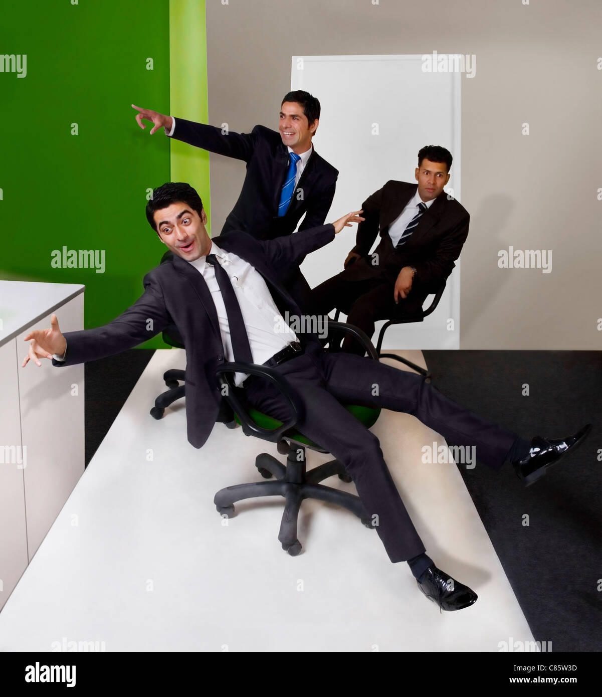 Businessmen having fun in the office Stock Photo - Alamy