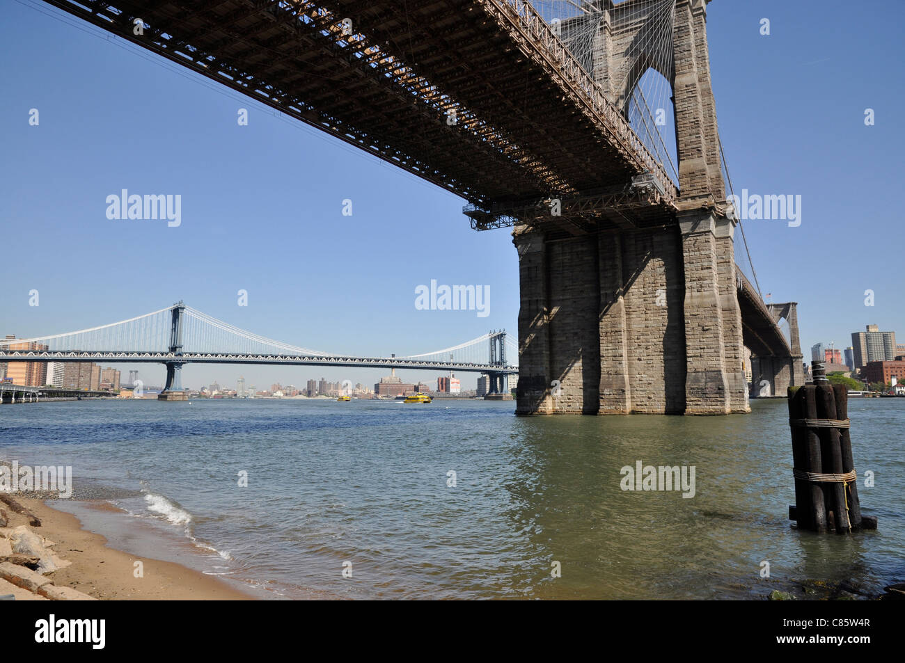 Brooklyn Bridge view from beneath with Manhattan Bridge in distance New ...