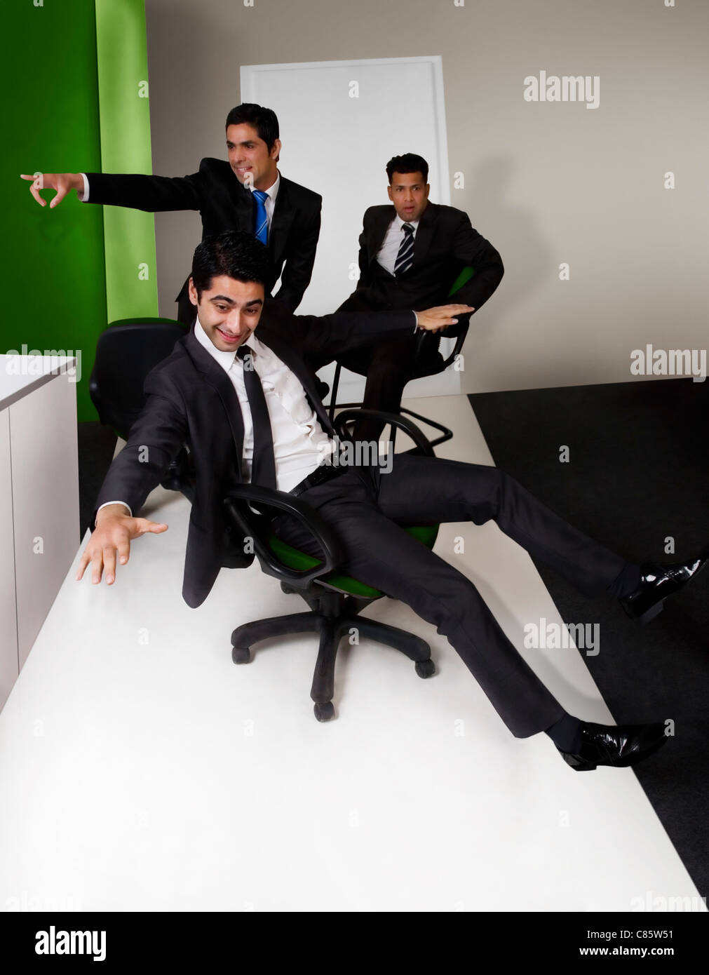 Businessmen having fun in the office Stock Photo - Alamy
