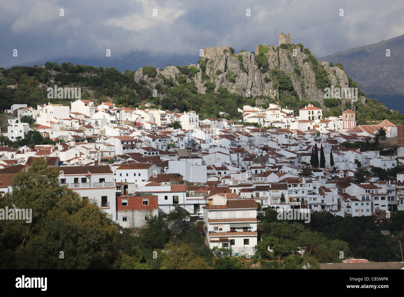 Late afternoon sunlight shining on the white painted houses and moorish ...