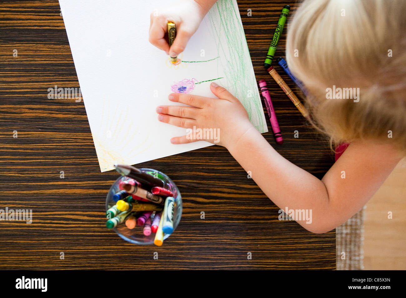 Little girl coloring with crayons Stock Photo - Alamy Little girl coloring with crayons Stock Photo - Alamy