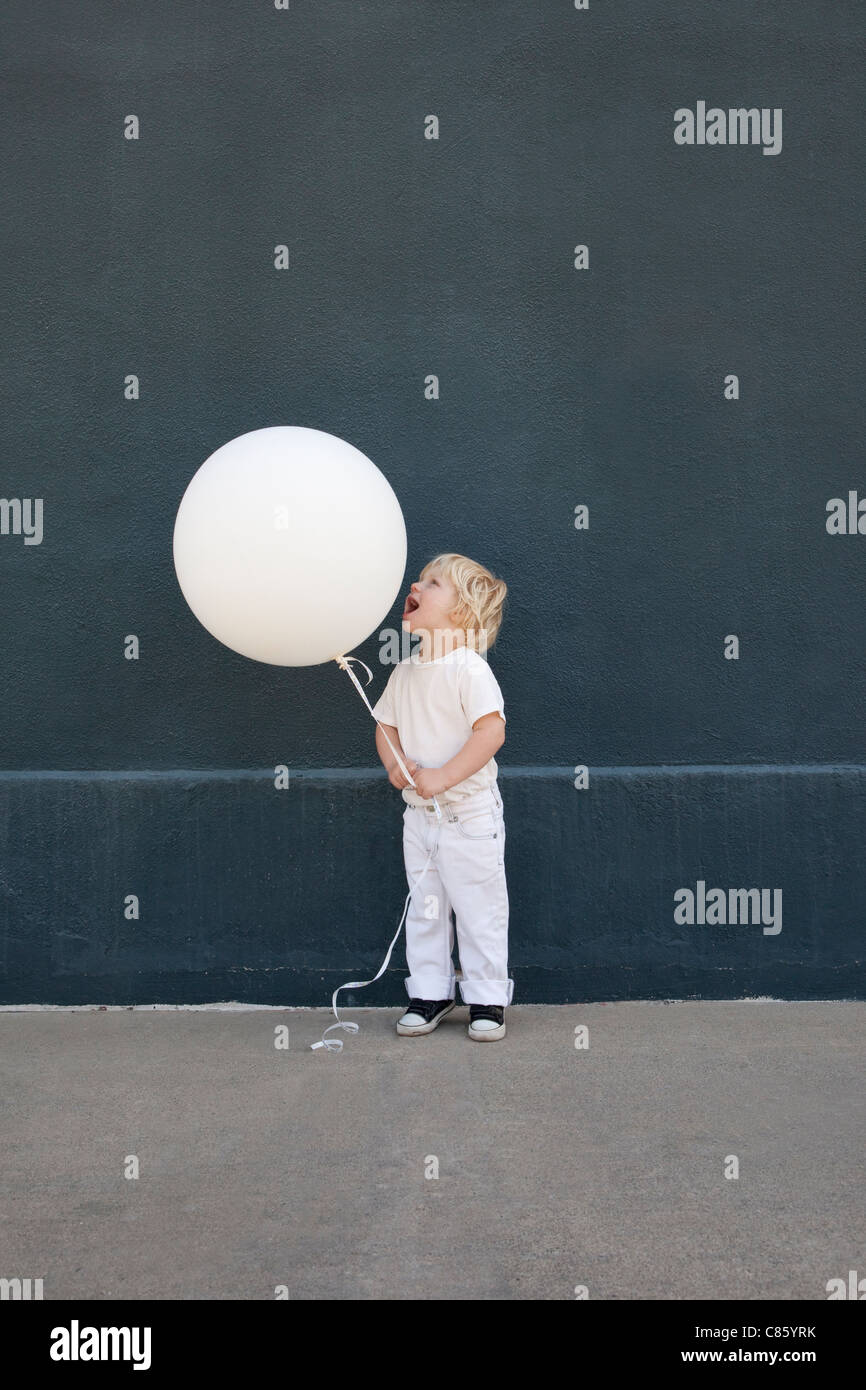 Little boy yelling at a balloon Stock Photo - Alamy