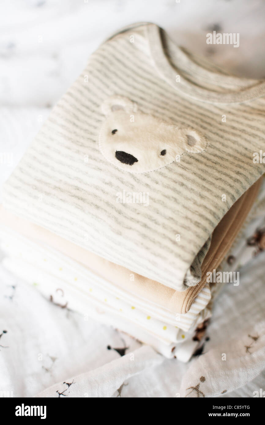 Stack of neatly folded baby clothes Stock Photo - Alamy