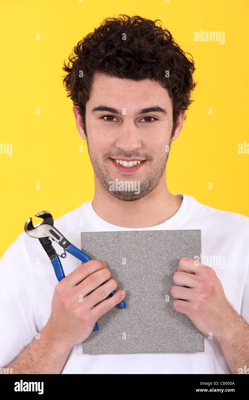 Portrait of a tiler Stock Photo - Alamy
