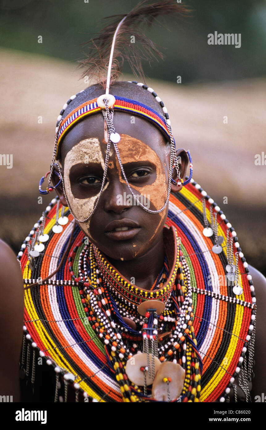 Lolgorian, Kenya. Siria Maasai Manyatta; woman with white and red ochre ...
