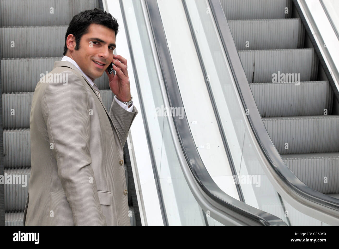 Man with mobile phone downtown Stock Photo - Alamy