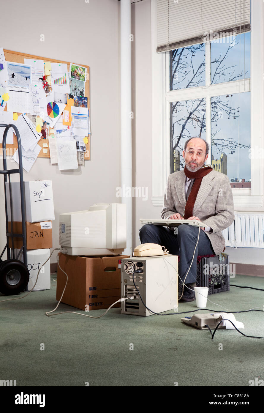 Caucasian businessman working in empty office Stock Photo - Alamy