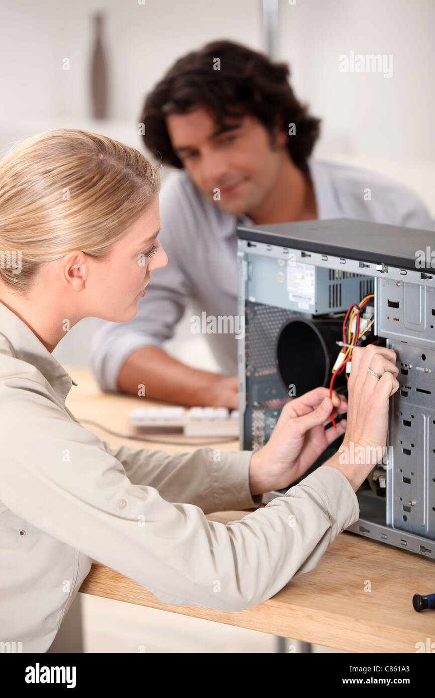 a female technician repairing a computer Stock Photo - Alamy
