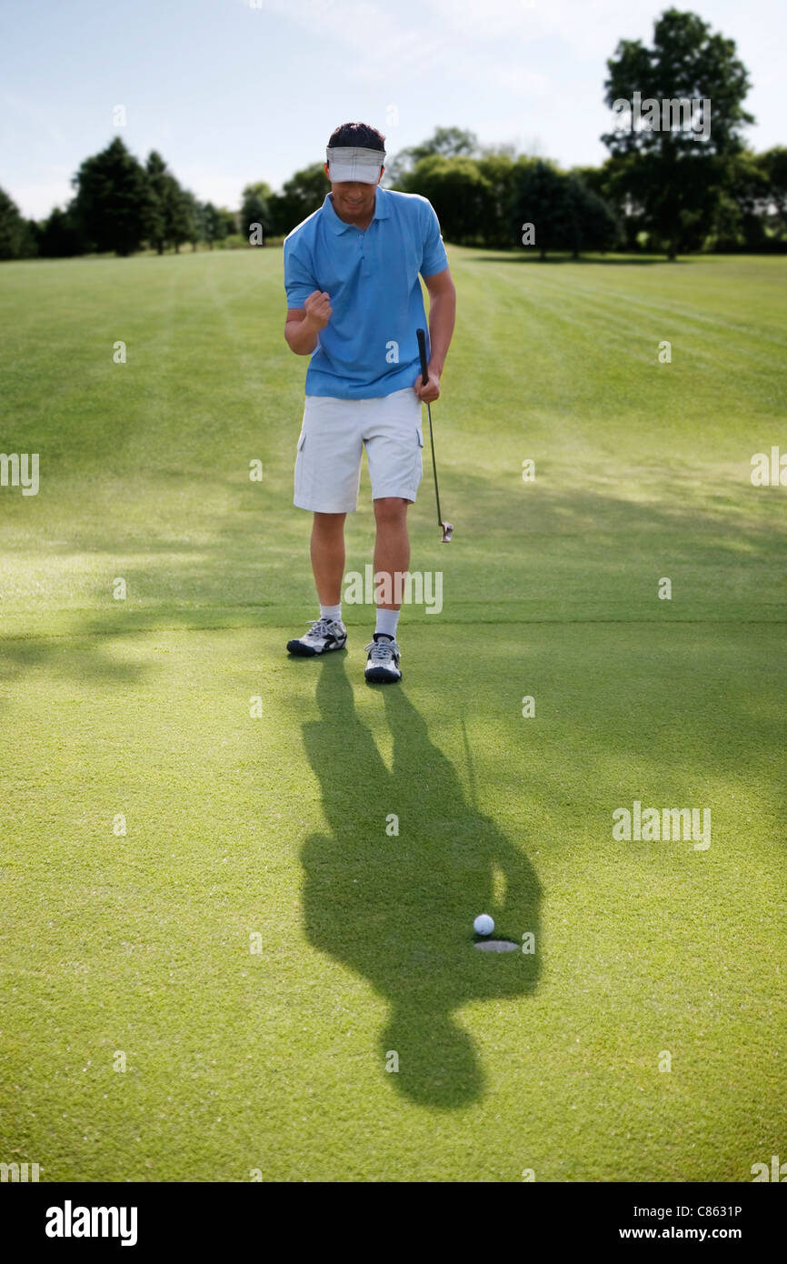Man playing golf Stock Photo - Alamy