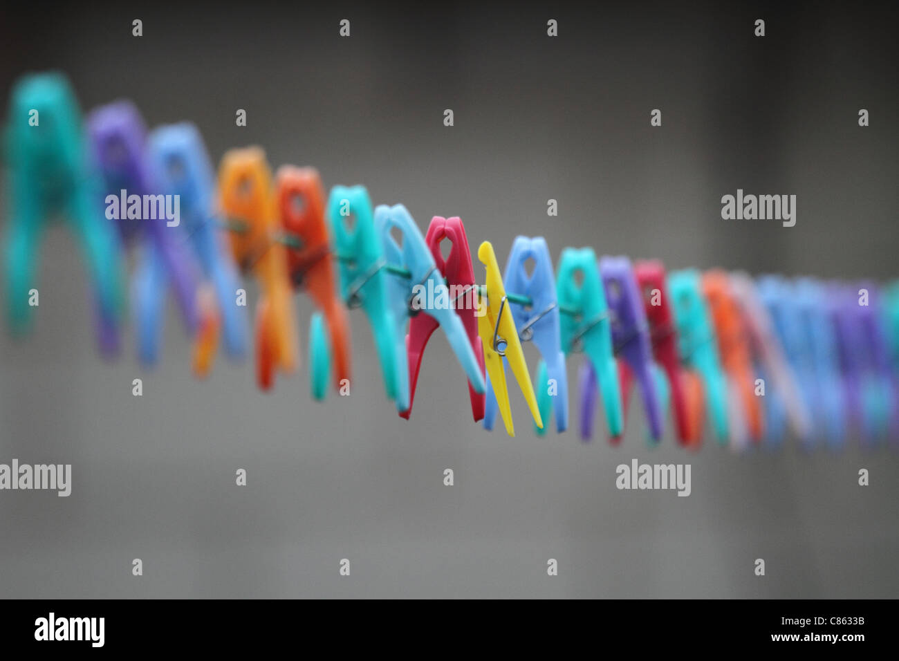 clothes pegs on washing line Stock Photo - Alamy