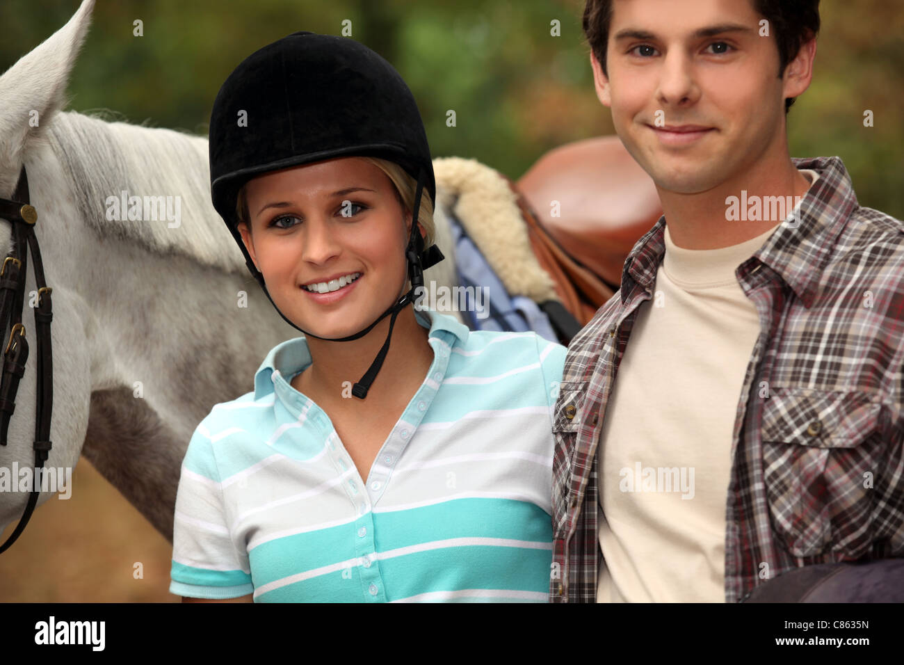 cute female horserider and boyfriend Stock Photo - Alamy