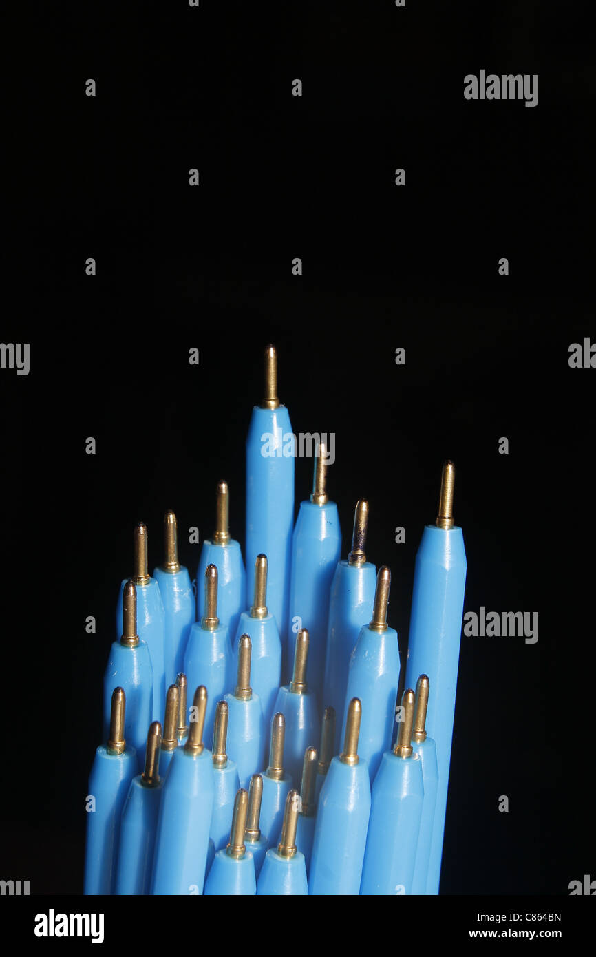 image of blue biro pens against black background Stock Photo - Alamy
