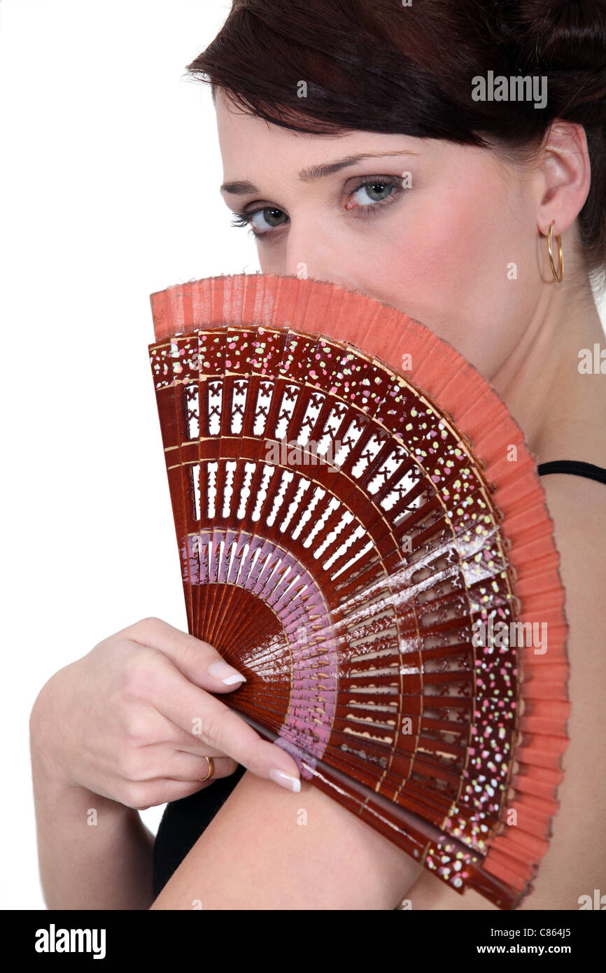 Woman holding a fan Stock Photo - Alamy