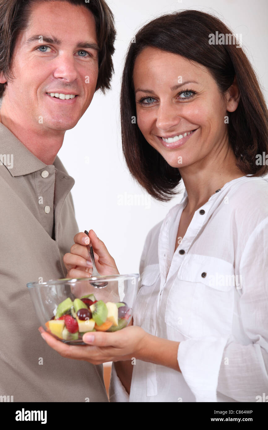 A couple sharing a salad Stock Photo - Alamy