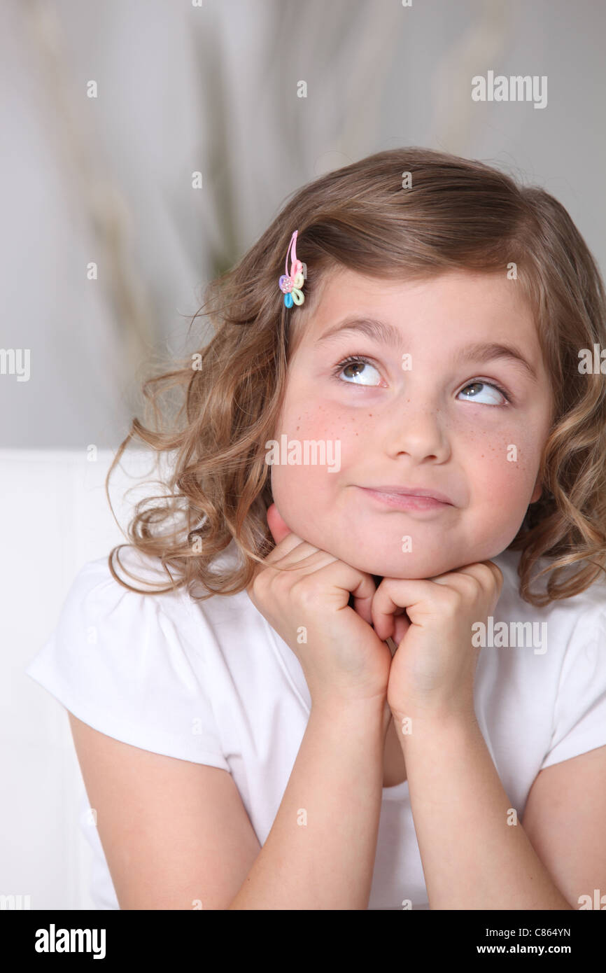 Adorable little girl looking up Stock Photo - Alamy